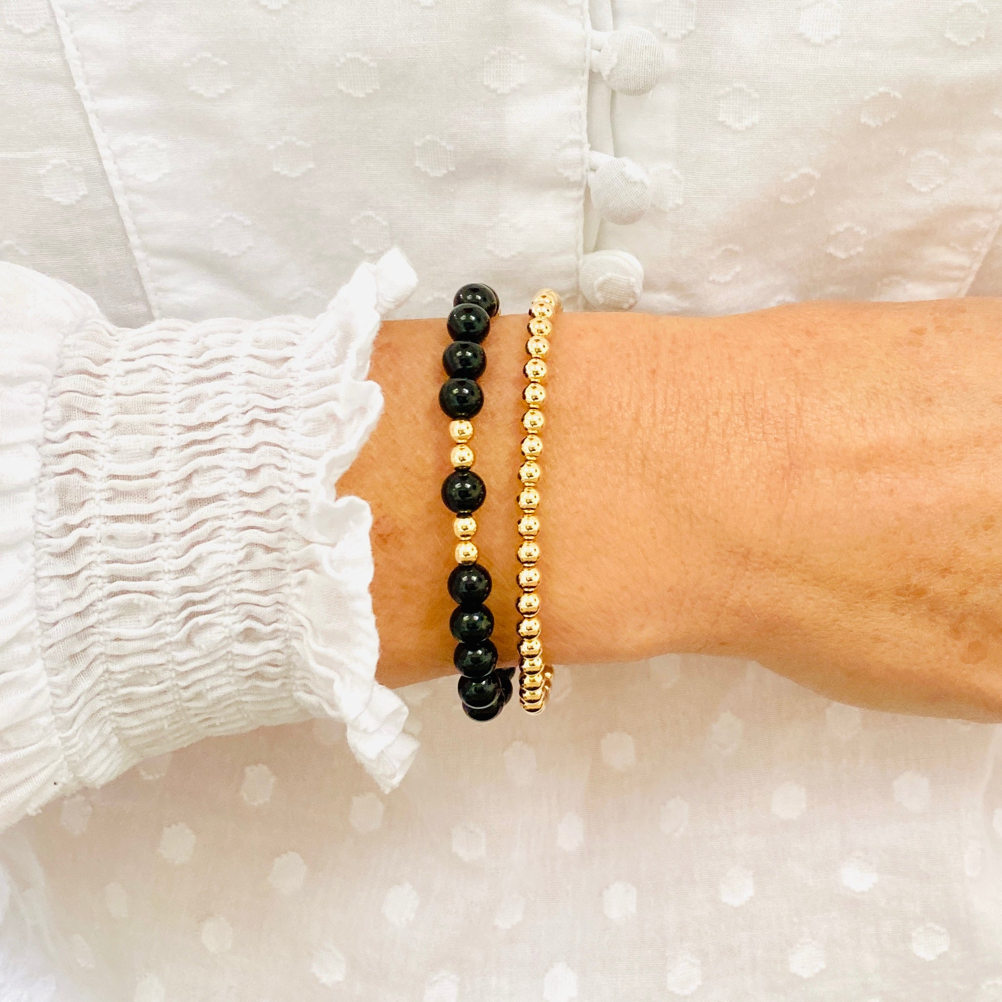 Black and gold bracelet store